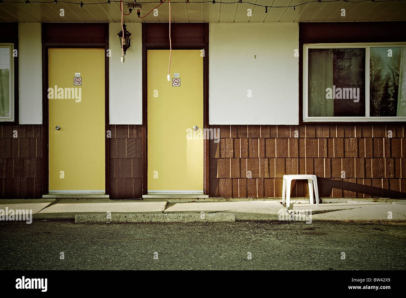 Vintage motel with yellow doors and dangling christmas lights, Dryden ...