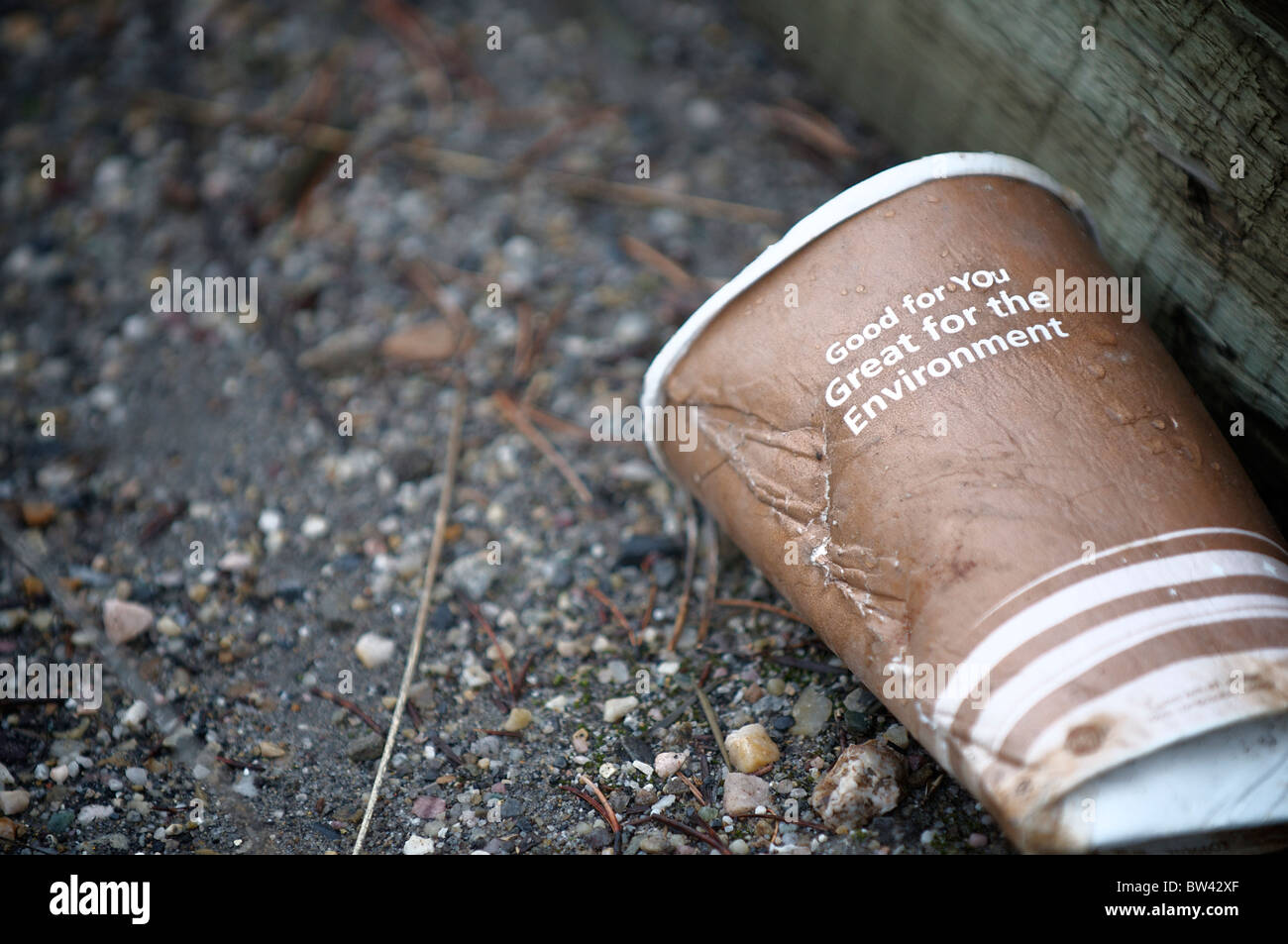 Discarded cup on the ground with green slogan, Banff National Park ...