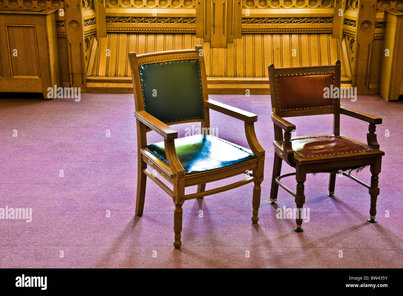 Two empty old-fashioned style business chairs Stock Photo - Alamy