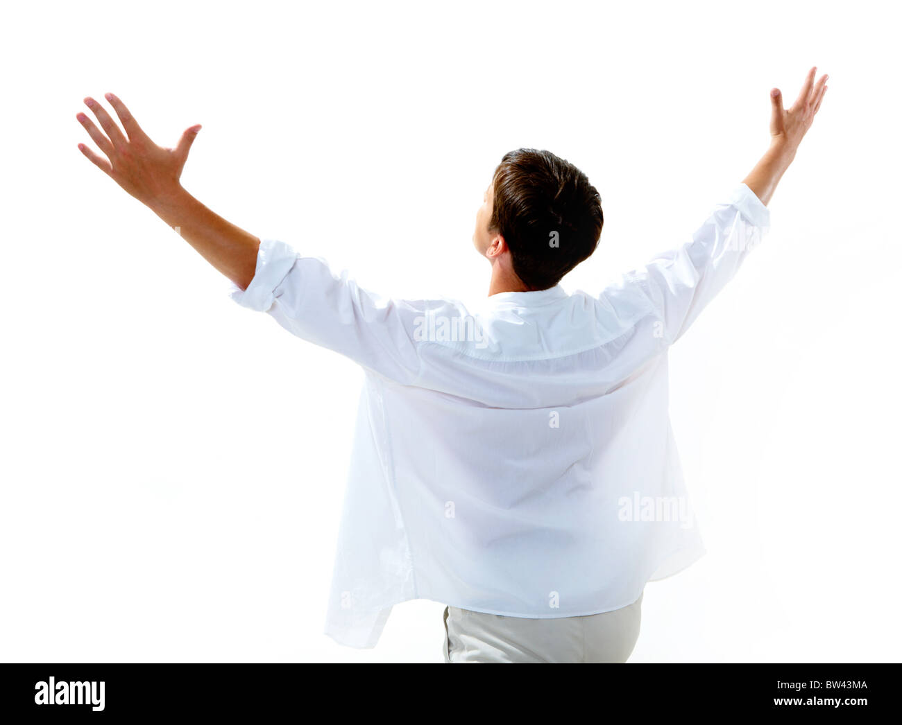 Back view of happy young man raising his arms enjoying life Stock Photo ...