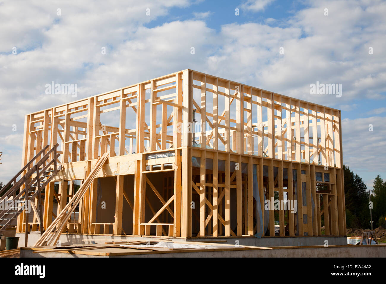 Two-storey wooden house frame under construction , Finland Stock Photo ...