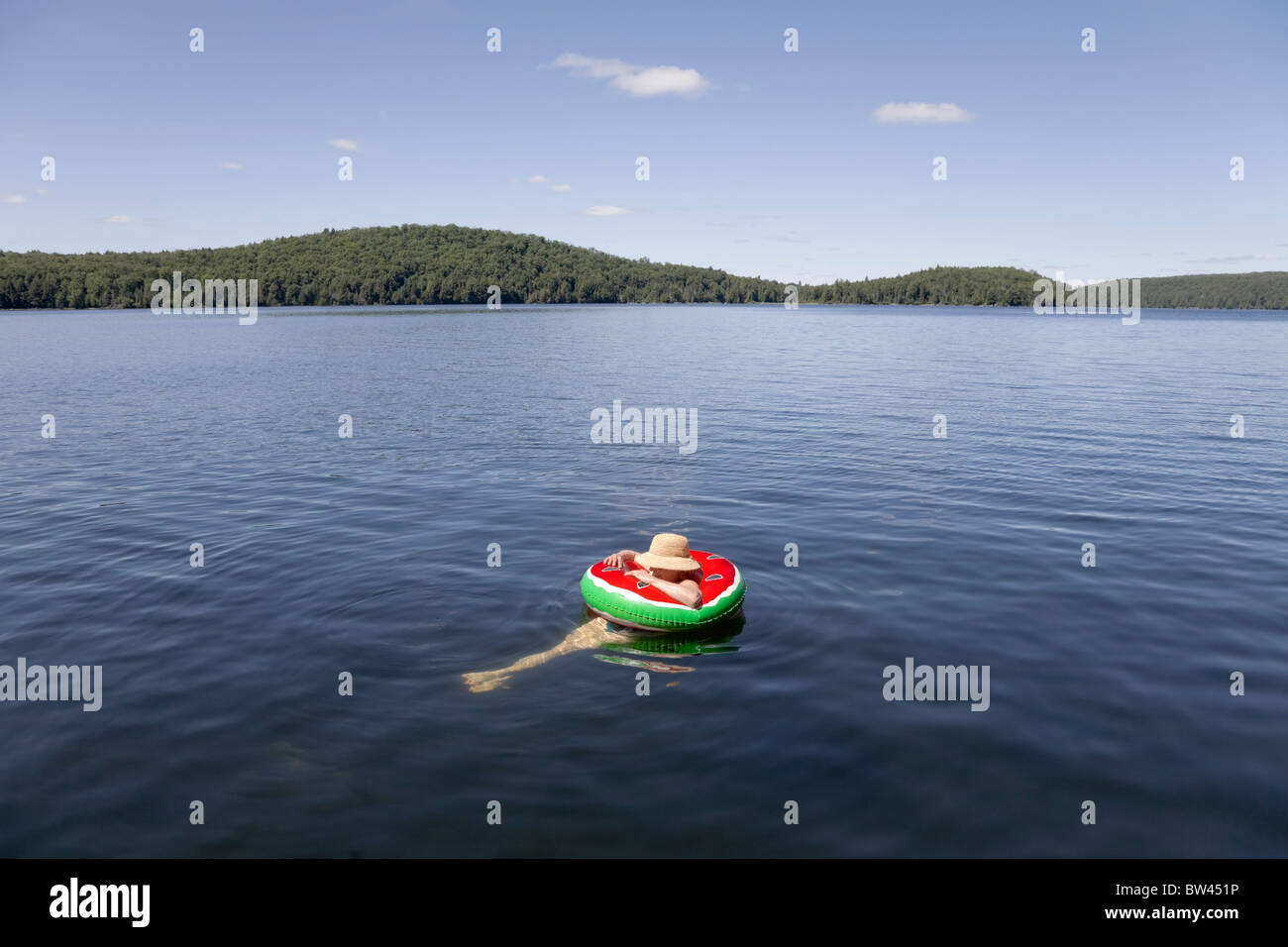 Woman floating in inner tube hi-res stock photography and images - Alamy