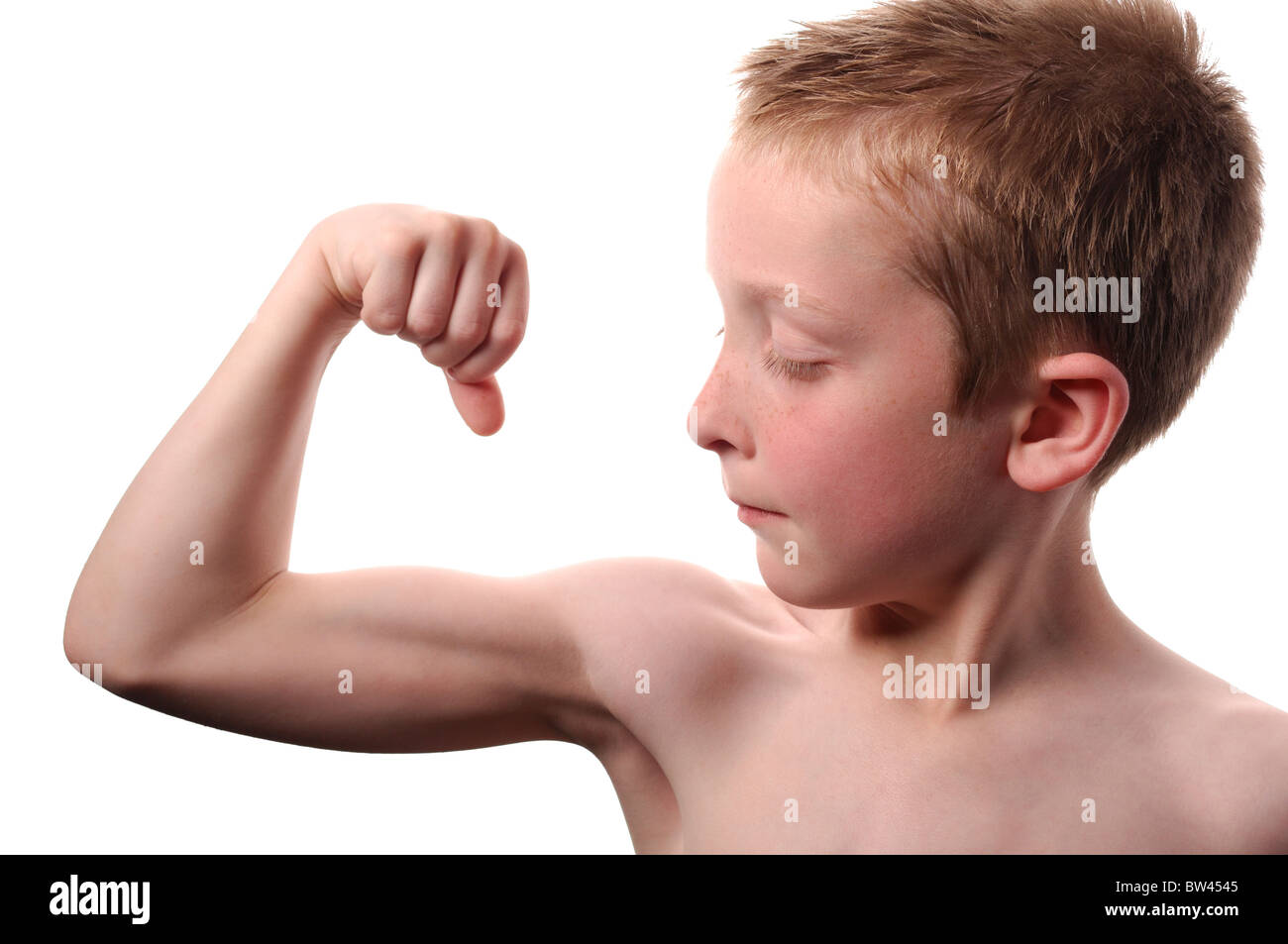 Young boy (age 8) flexing his muscles Stock Photo - Alamy