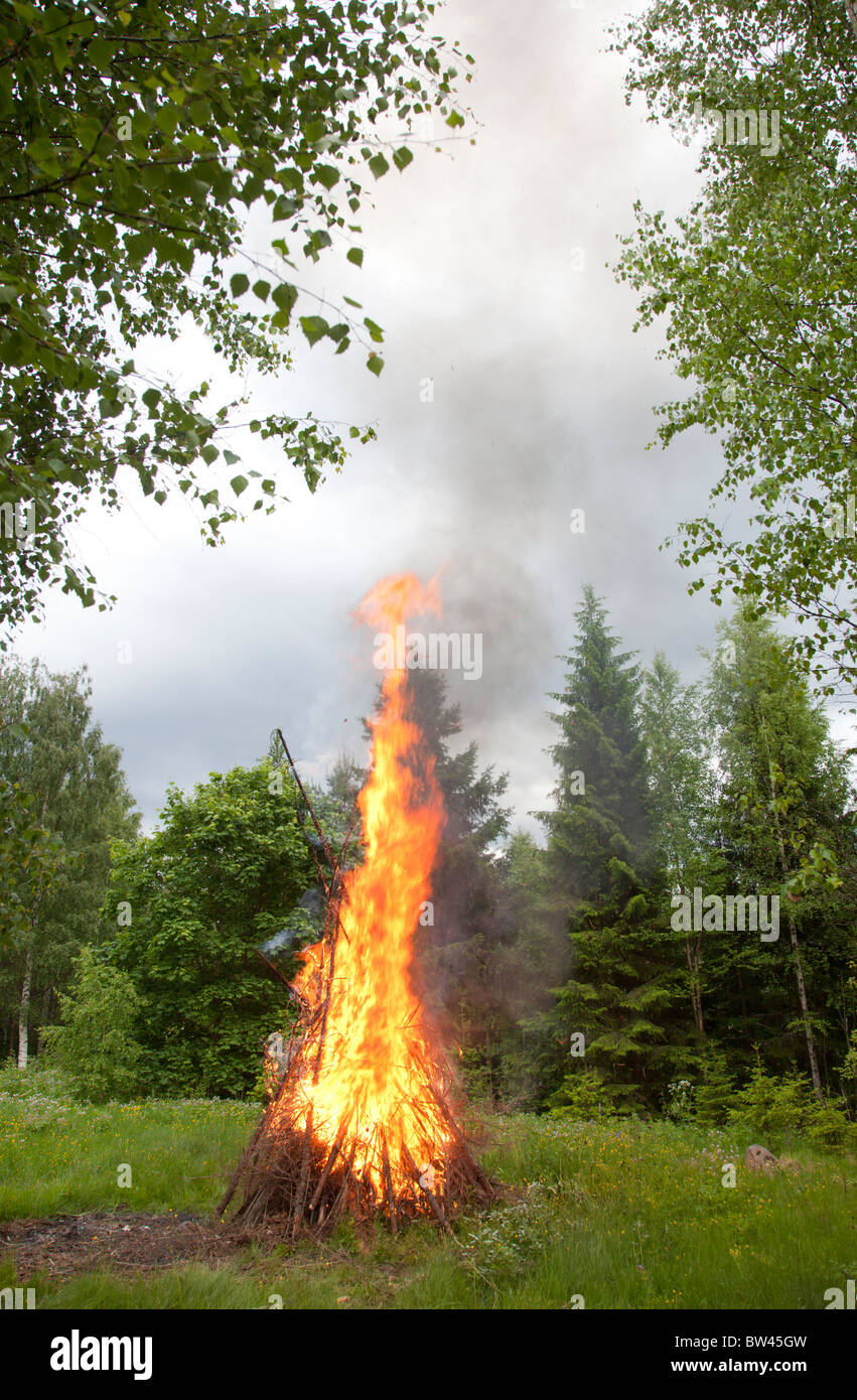 Burning midsummer pyre , Finland Stock Photo - Alamy