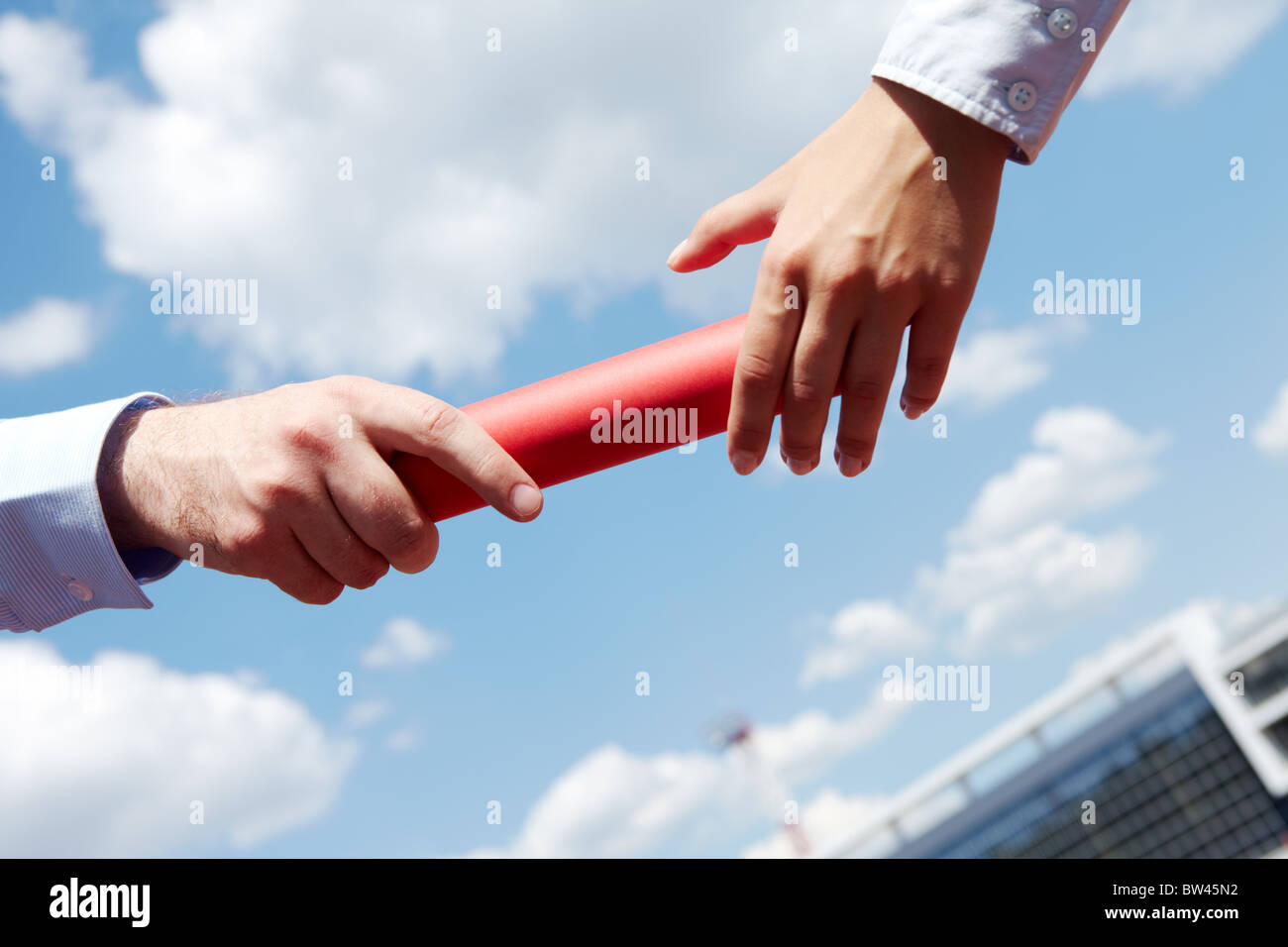 Photo of business people hands passing baton during marathon Stock ...