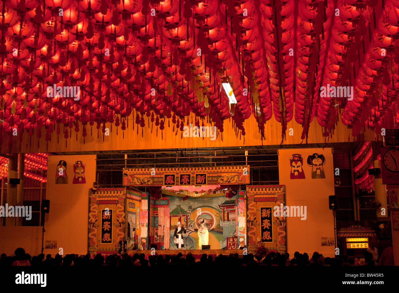 Members of the audience watch a performance by the Sing Sai Hong troupe ...