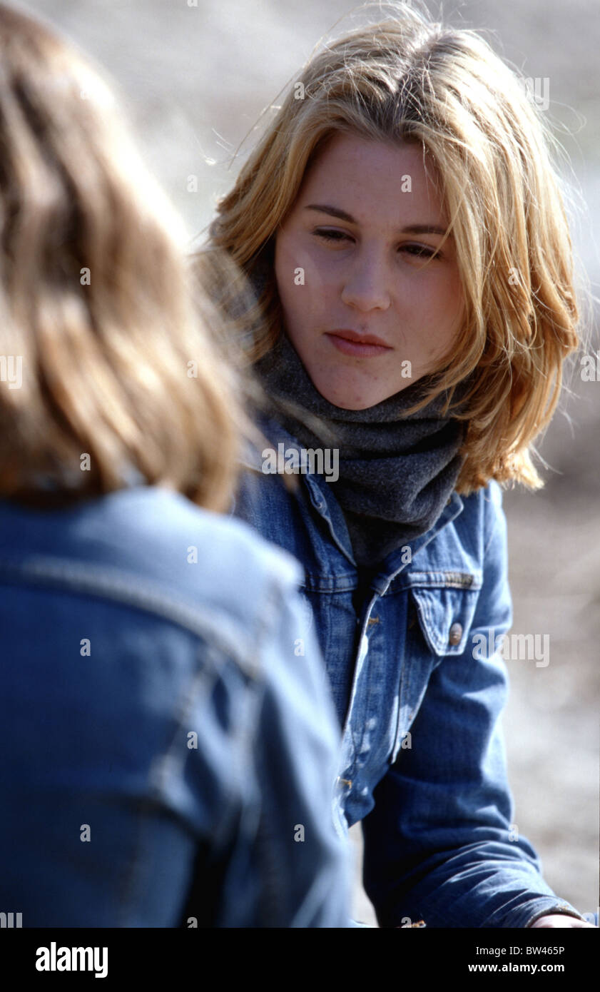 Two young women talking seriously hi-res stock photography and images ...