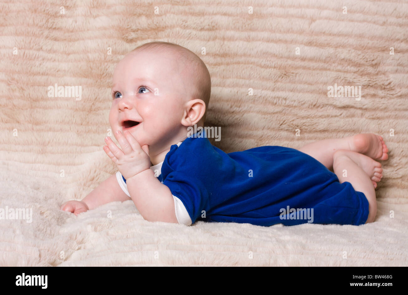 Adorable expressive happy baby boy from low perspective Stock Photo - Alamy
