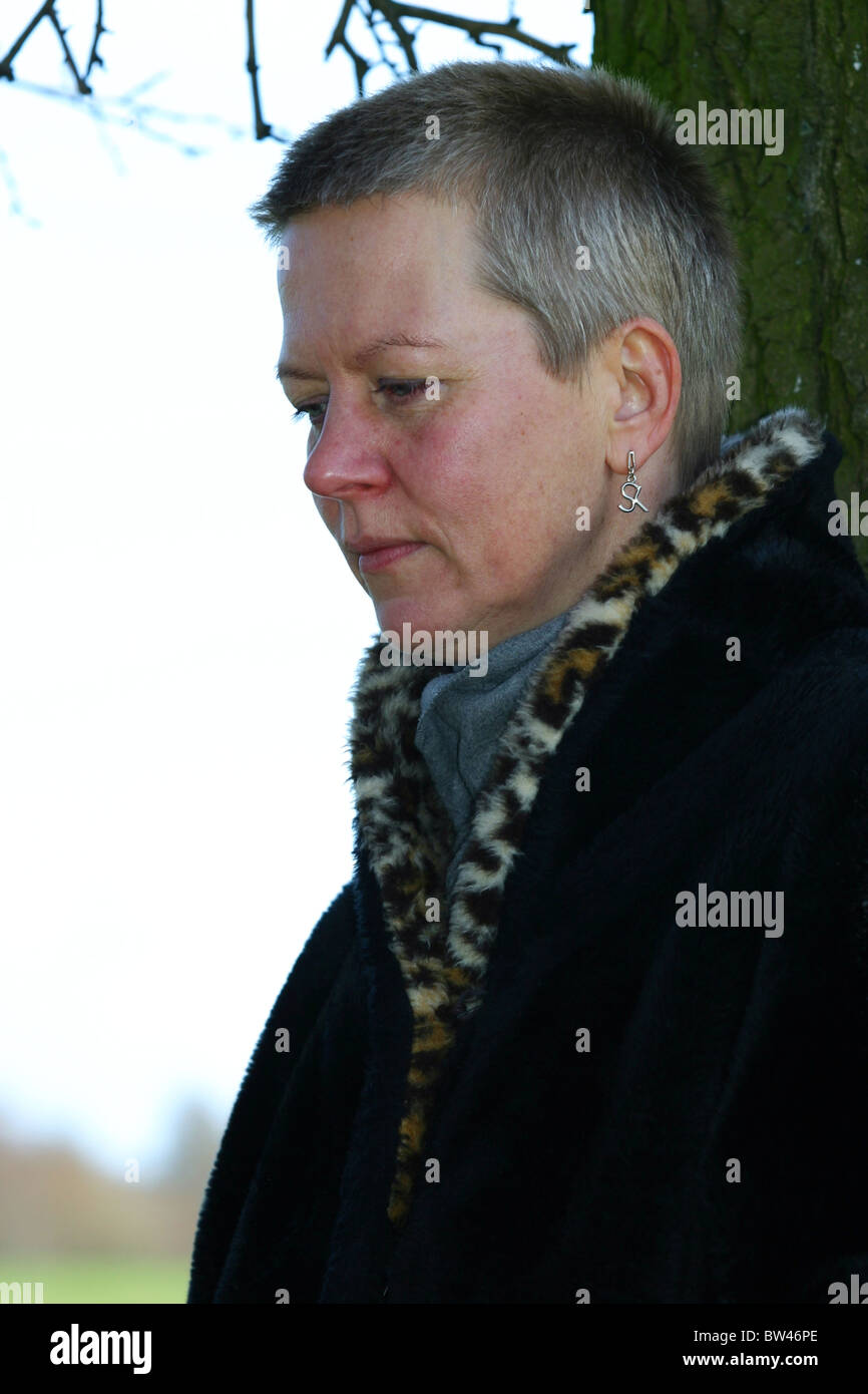 Sad Woman Leaning Against Tree High Resolution Stock Photography and ...