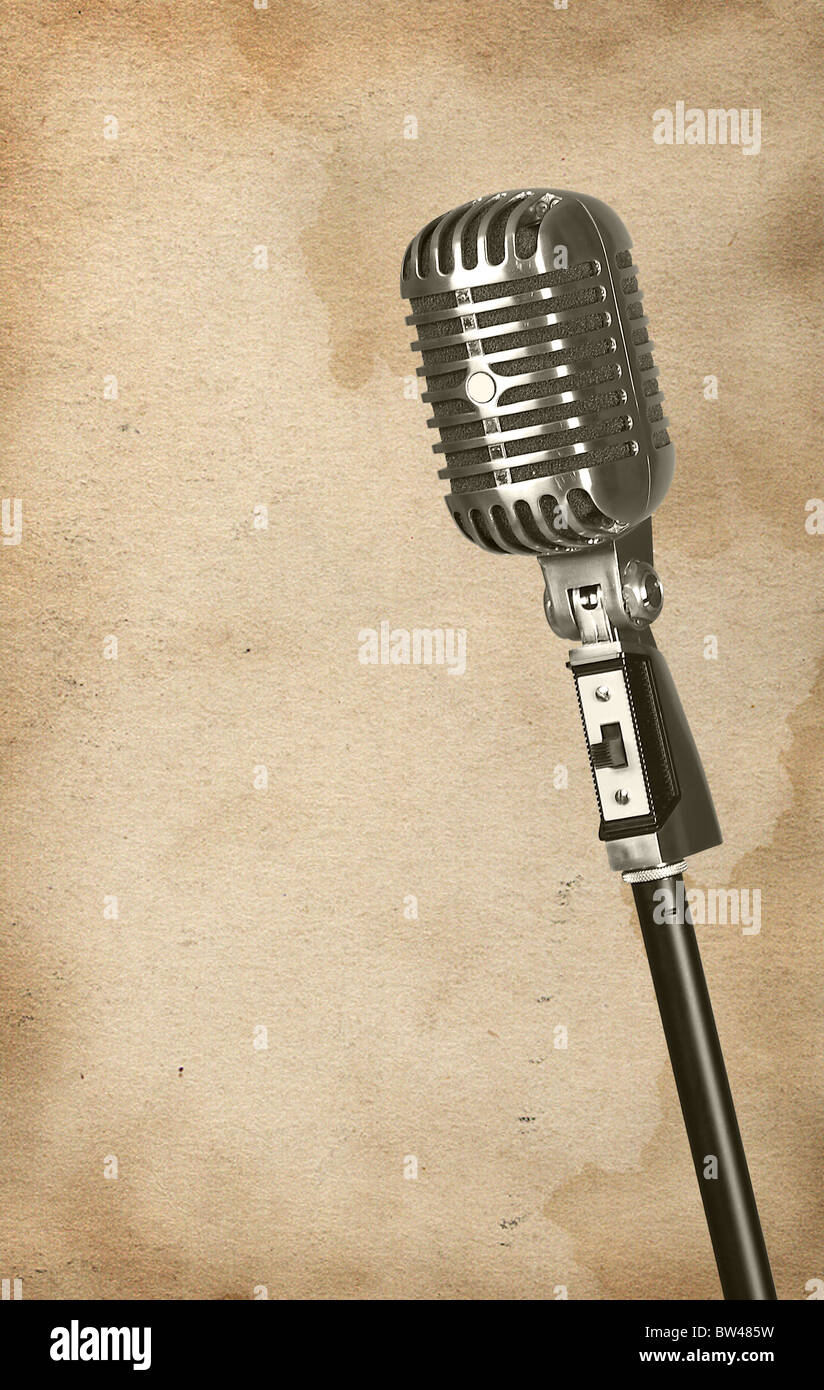 Retro microphone on paper background Stock Photo - Alamy
