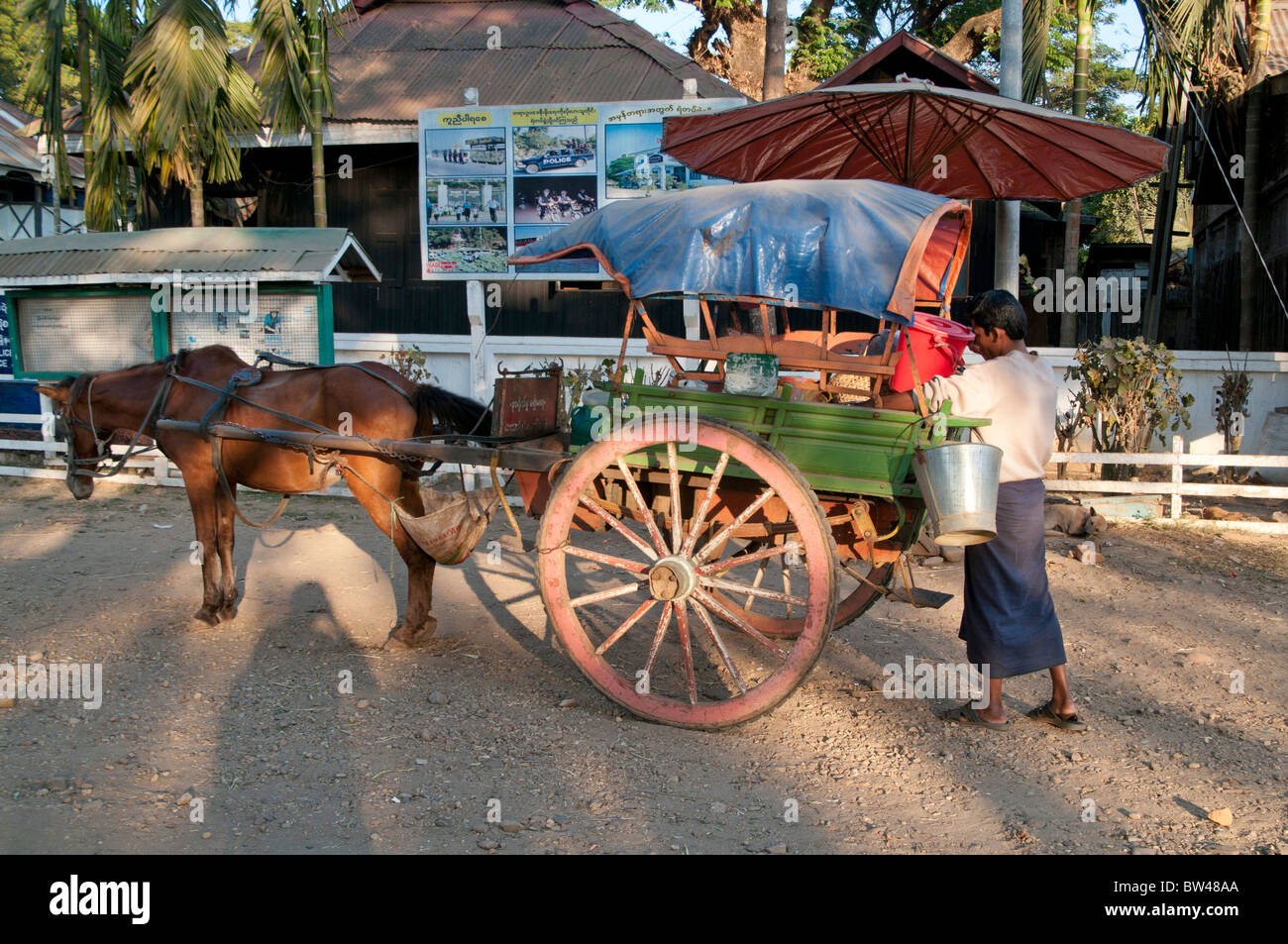 MYANMAR/BURMA. MAN AND HORSE DRAWN CART IN THE VILLAGE OF KATHA IN ...