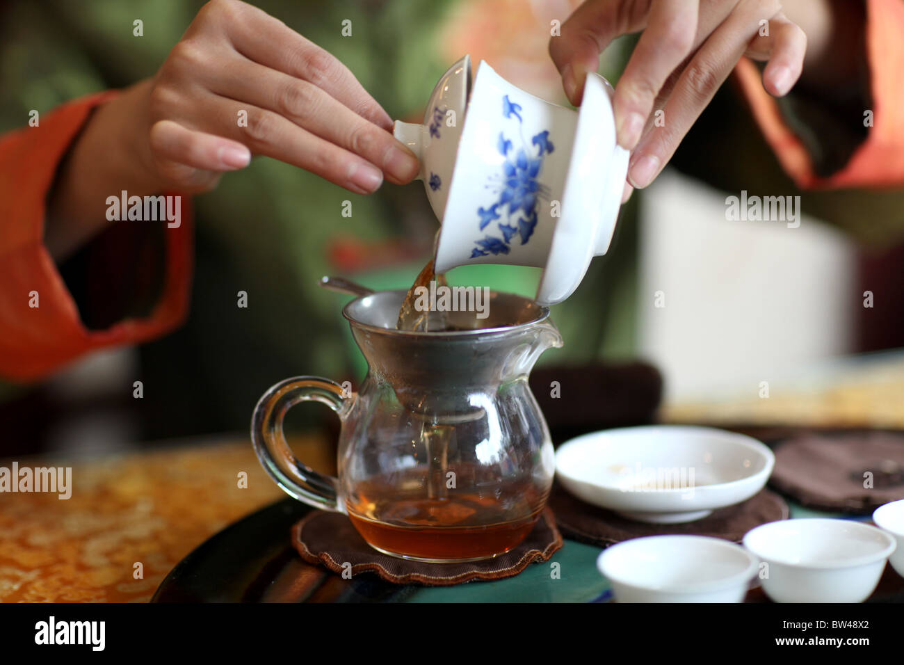 A traditional tea ceremony being performed at a teahouse in Kunming ...
