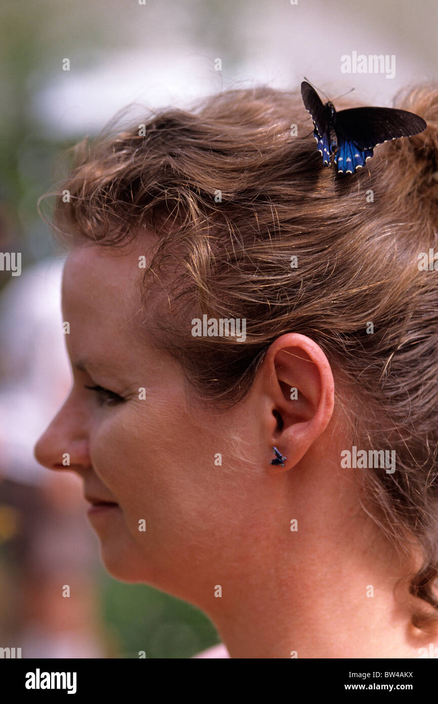 Woman at the Woodland Park Zoo butterfly exhibit with a butterfly in ...