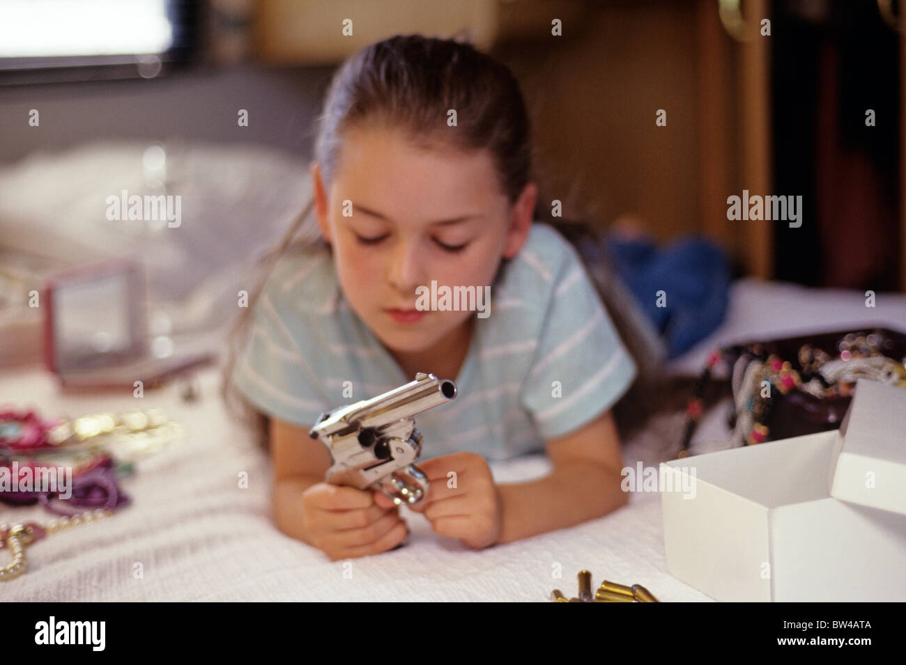 Young girl (8 years old) discovers handgun in parents bedroom snooping ...