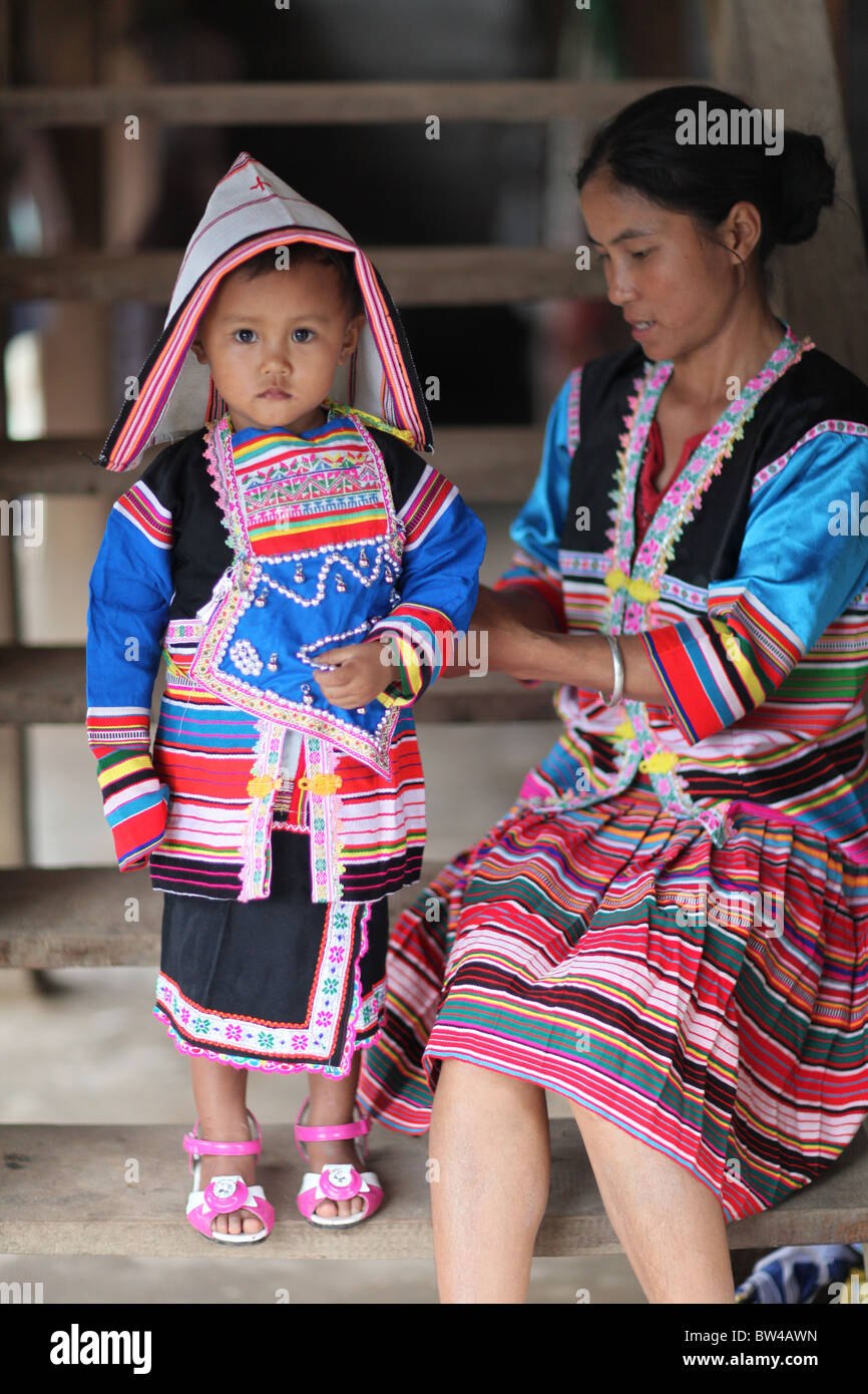 A family dressed in traditional Dai clothing near the town of ...