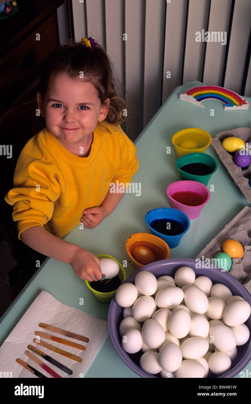 Girl coloring Easter eggs (multi-colors) Easter Egg hunt Stock Photo ...