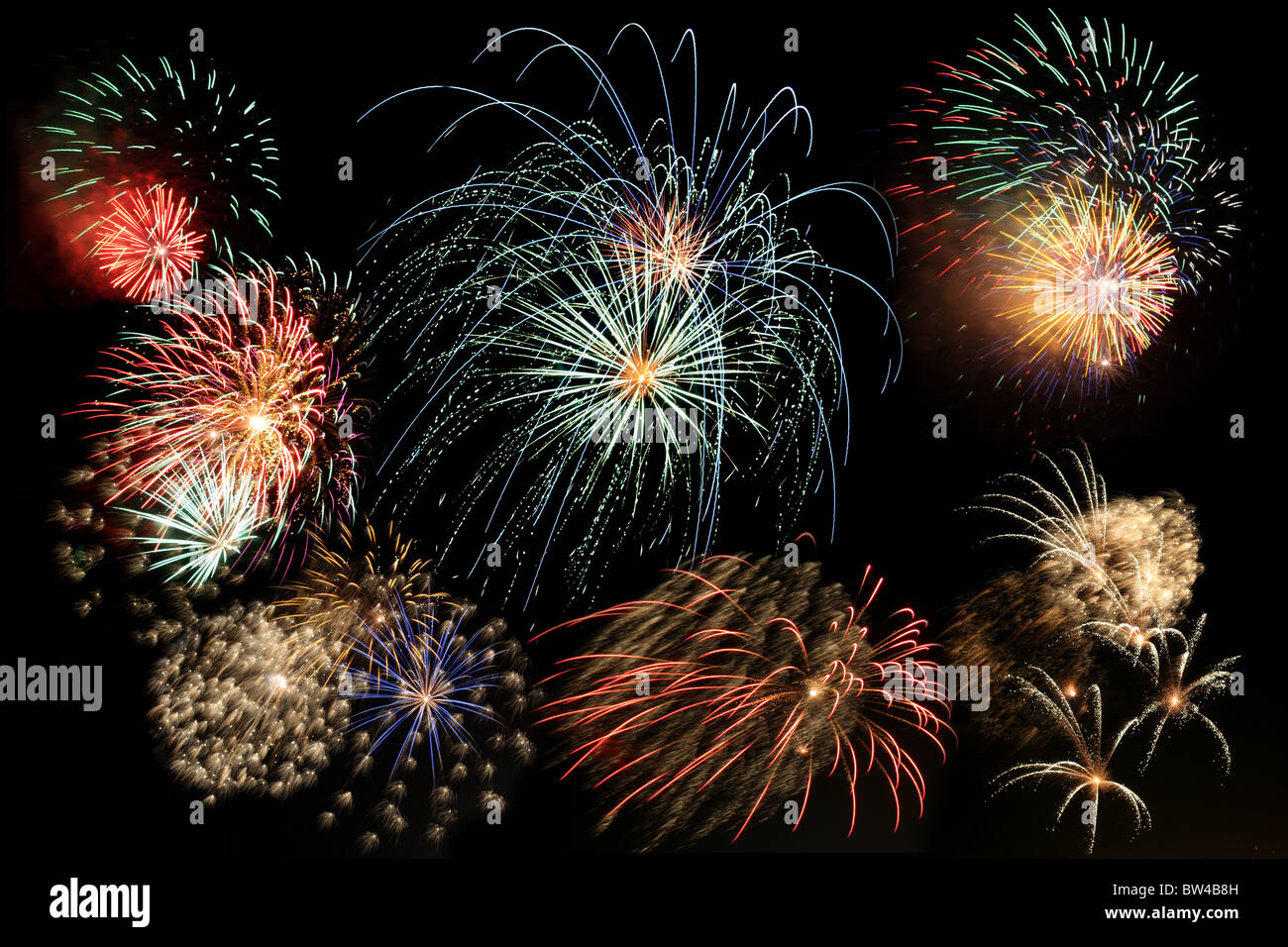 Multiple bursts of multicolored fireworks fill the frame against a ...