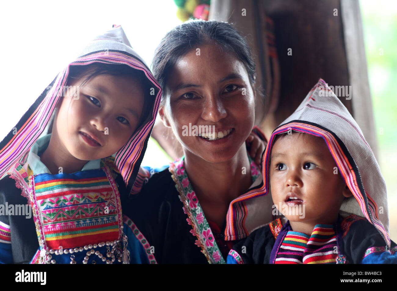 A family dressed in traditional Dai clothing near the town of ...