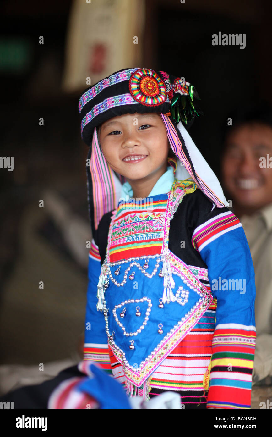 A young girl dressed in traditional Dai clothing near the town of ...
