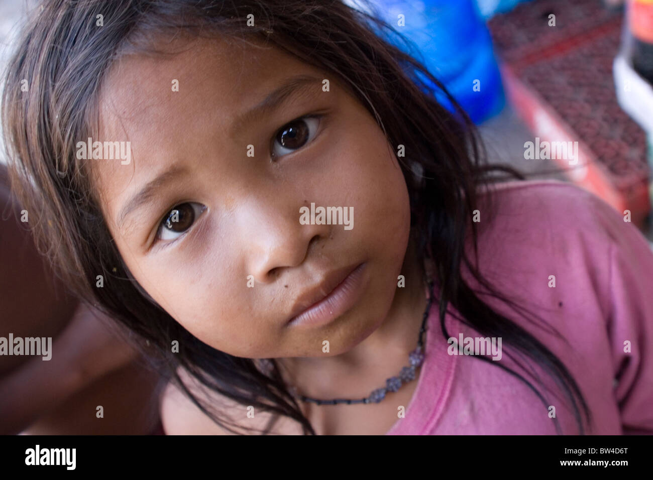 A hungry street child girl is in need of food on the streets of Kampong ...
