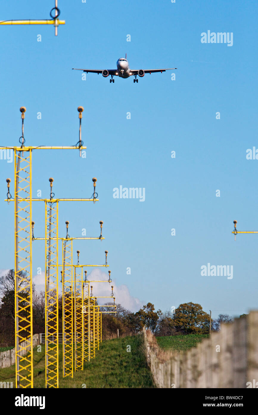 A plane approaching landing lights at Edinburgh airport Stock Photo - Alamy