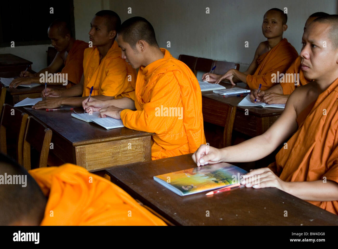 Buddhist monks are studying in a classroom during a high school class ...