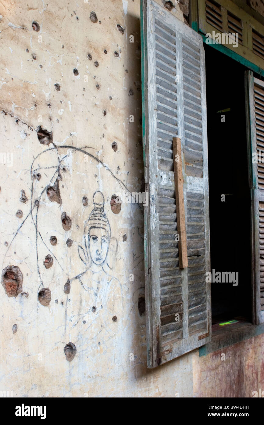 A wall with pock marks made by bullets of Khmer Rouge soldiers is part ...