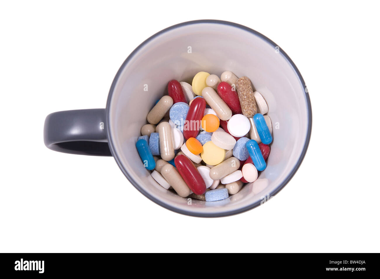 front view from cup of multicolored tablets and capsules Stock Photo ...