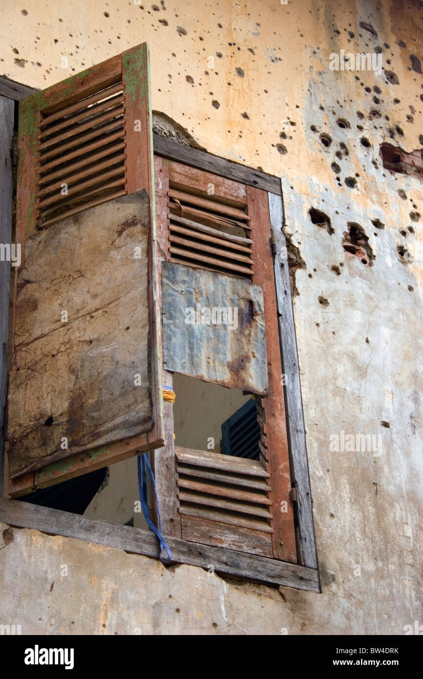 A wall with pock marks made by bullets of Khmer Rouge soldiers is part ...
