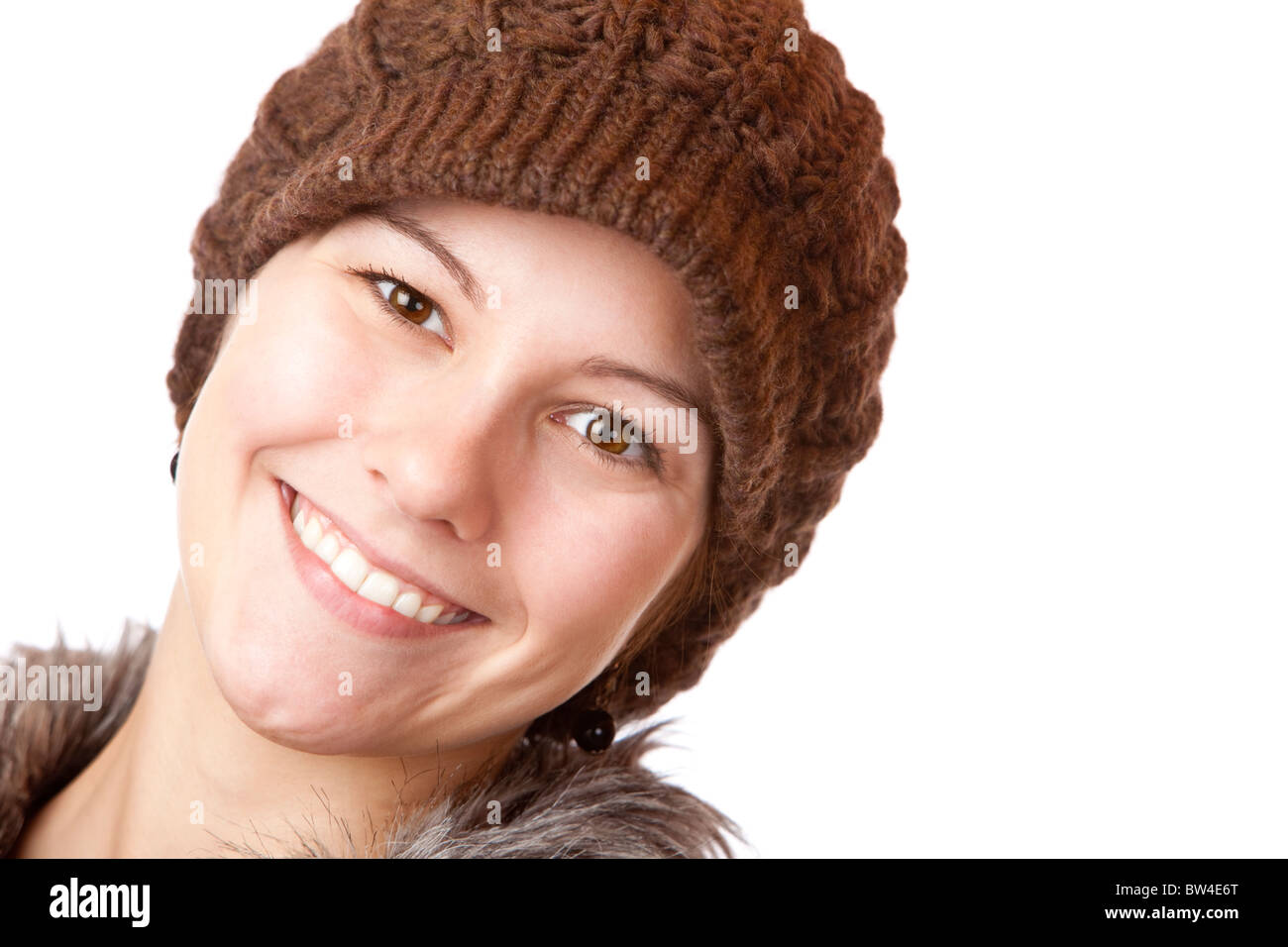 Beautiful girl with cap smiles happy. Isolated on white background ...