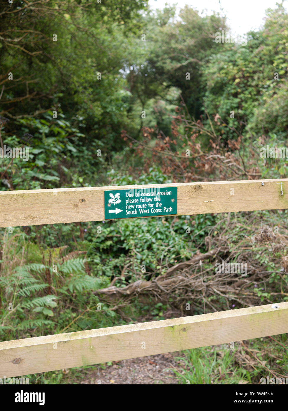 sign advising walkers to avoid dangerous path due to coastal erosion at ...