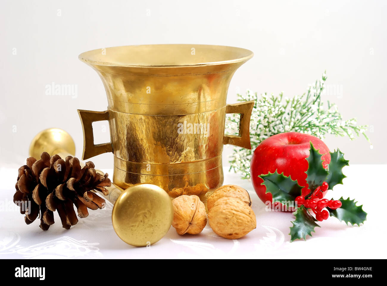 Gold mortar and christmas decorations Stock Photo - Alamy