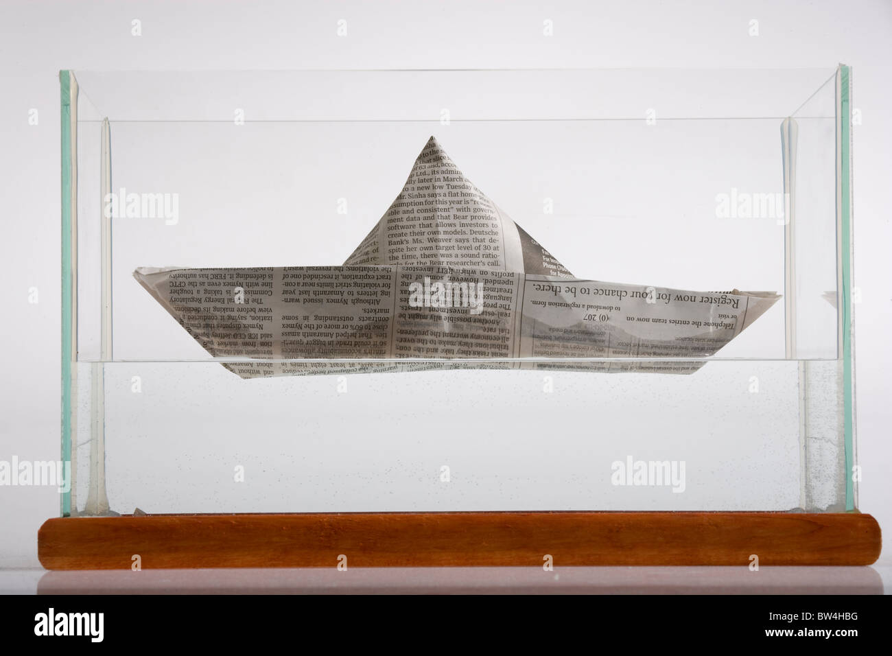 Paper boat riding the waves Stock Photo - Alamy
