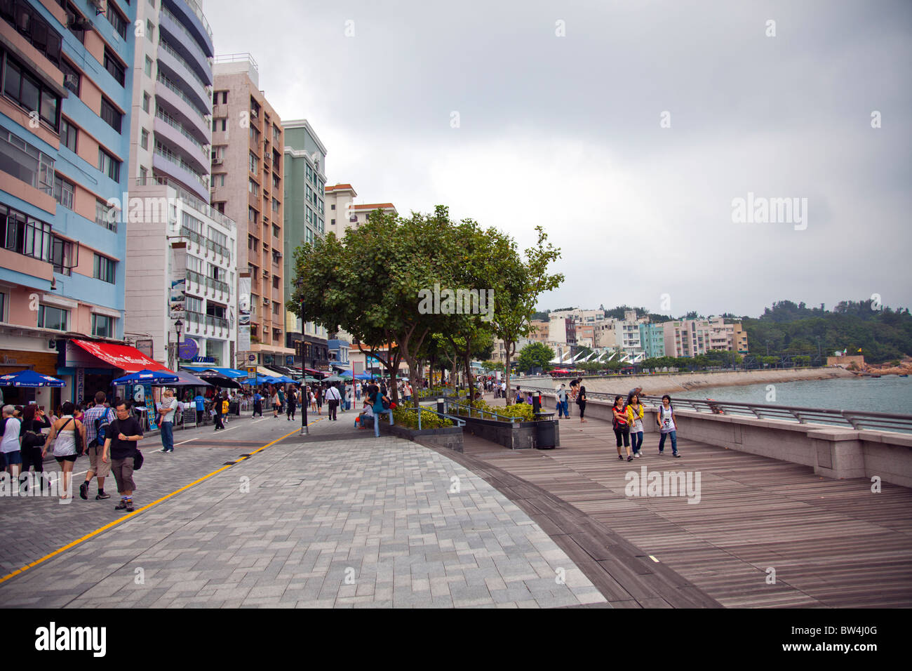 Stanley on Hong Kong Island, waterfront promenade with people walking ...
