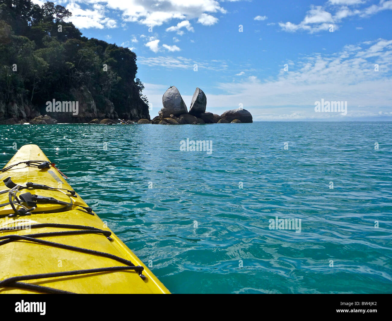 A unique rock formation known as Split Apple Rock surfaces out of the ...