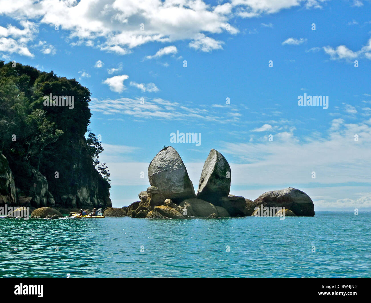 A unique rock formation known as Split Apple Rock surfaces out of the ...