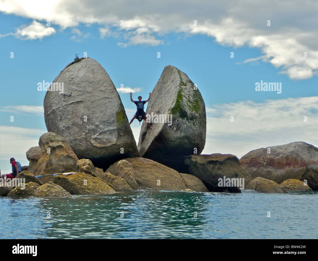 A unique rock formation known as Split Apple Rock surfaces out of the ...