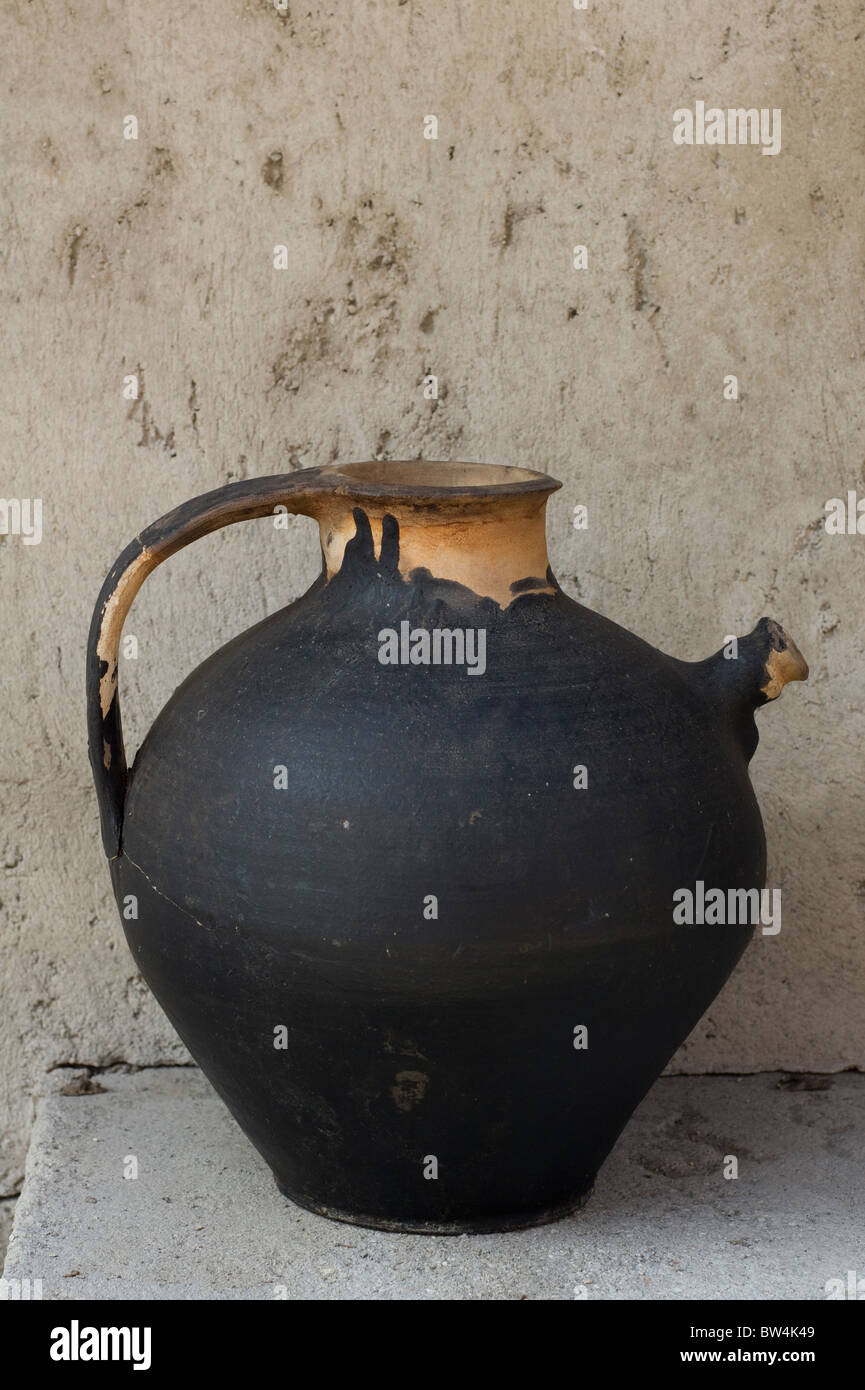 Old clay jar with handle Stock Photo - Alamy