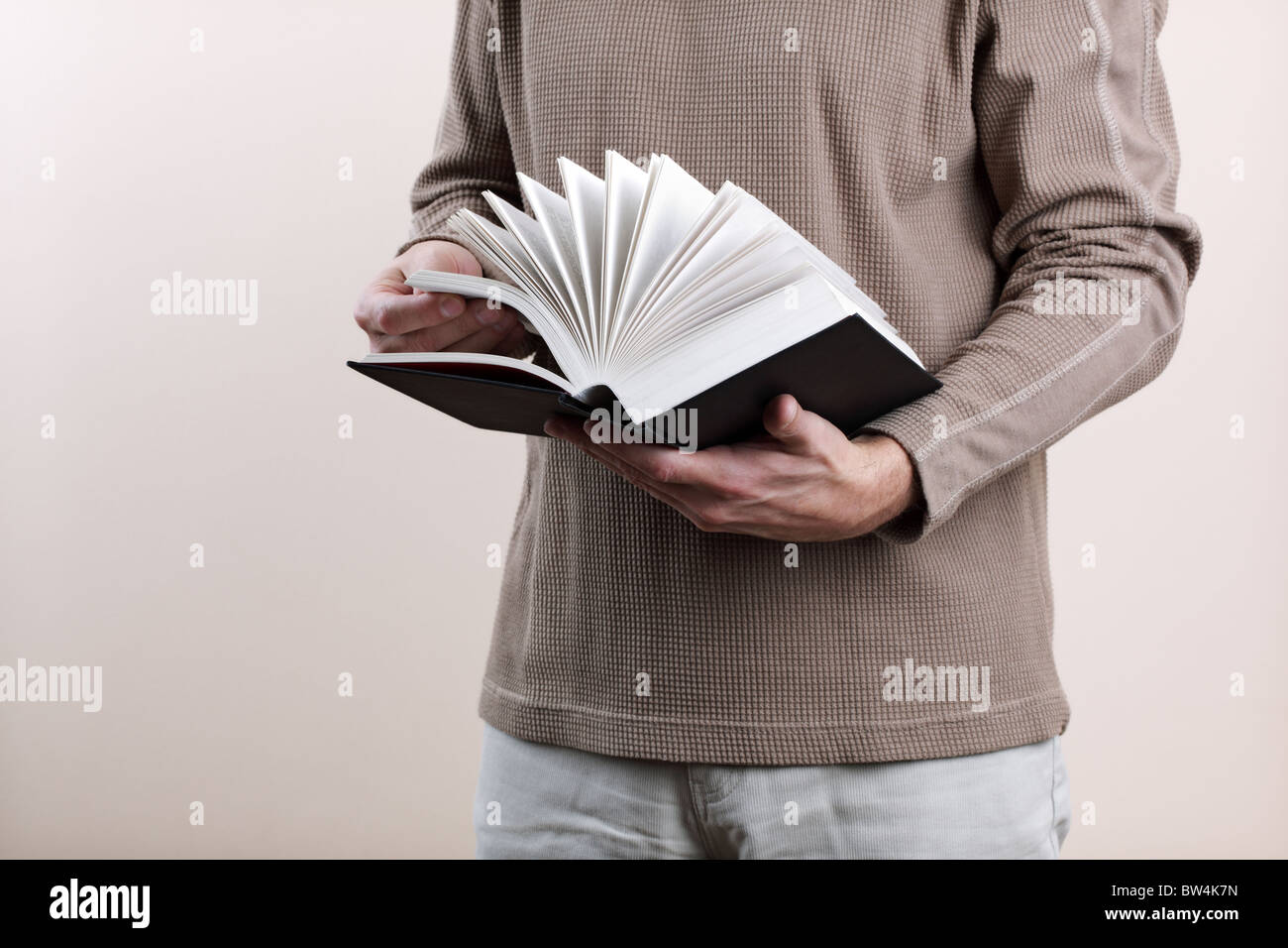 Man flipping pages in book hi-res stock photography and images - Alamy