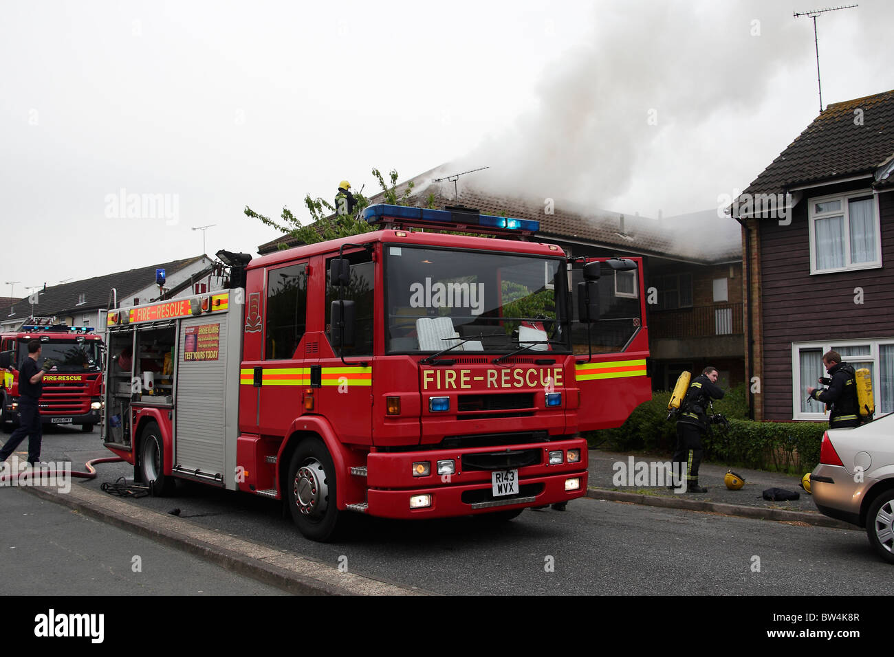 Fire engine at the scene of a fire Stock Photo - Alamy