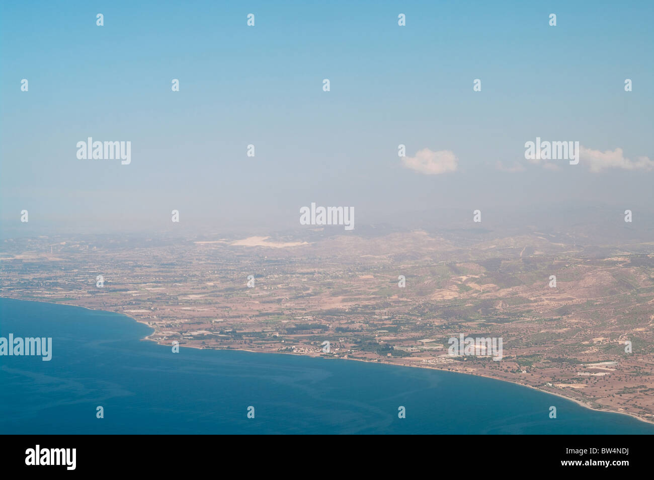 The view from an airplane in island of Cyprus. Seacoast line with blue ...