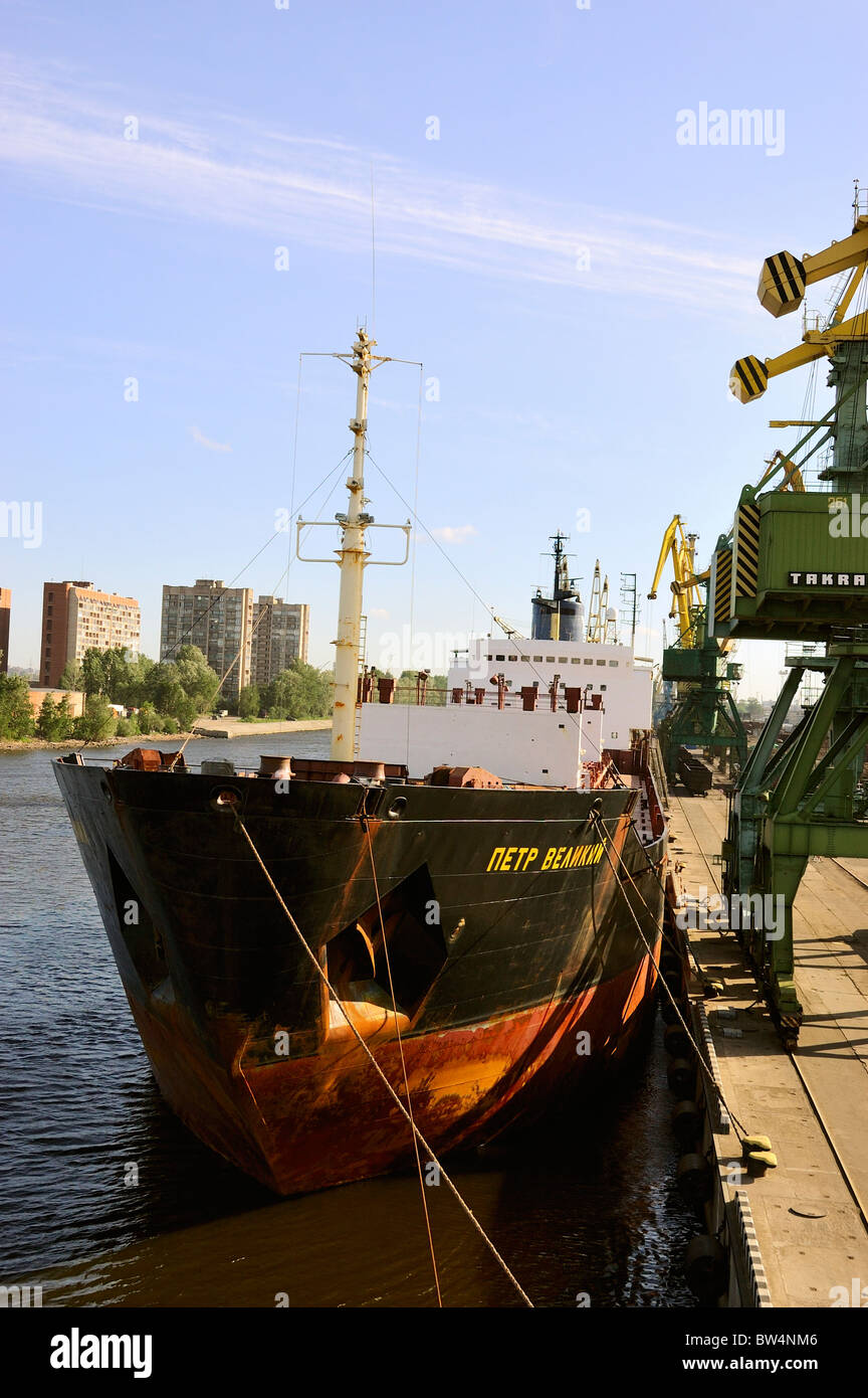 A Russian merchant ship loading cargo in St Petersburg harbour, Russia ...