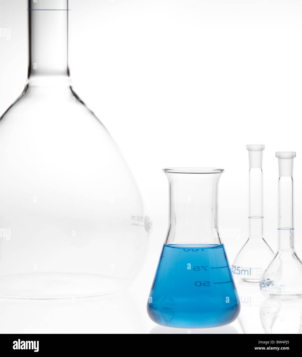 Chemical flasks over white background Stock Photo - Alamy