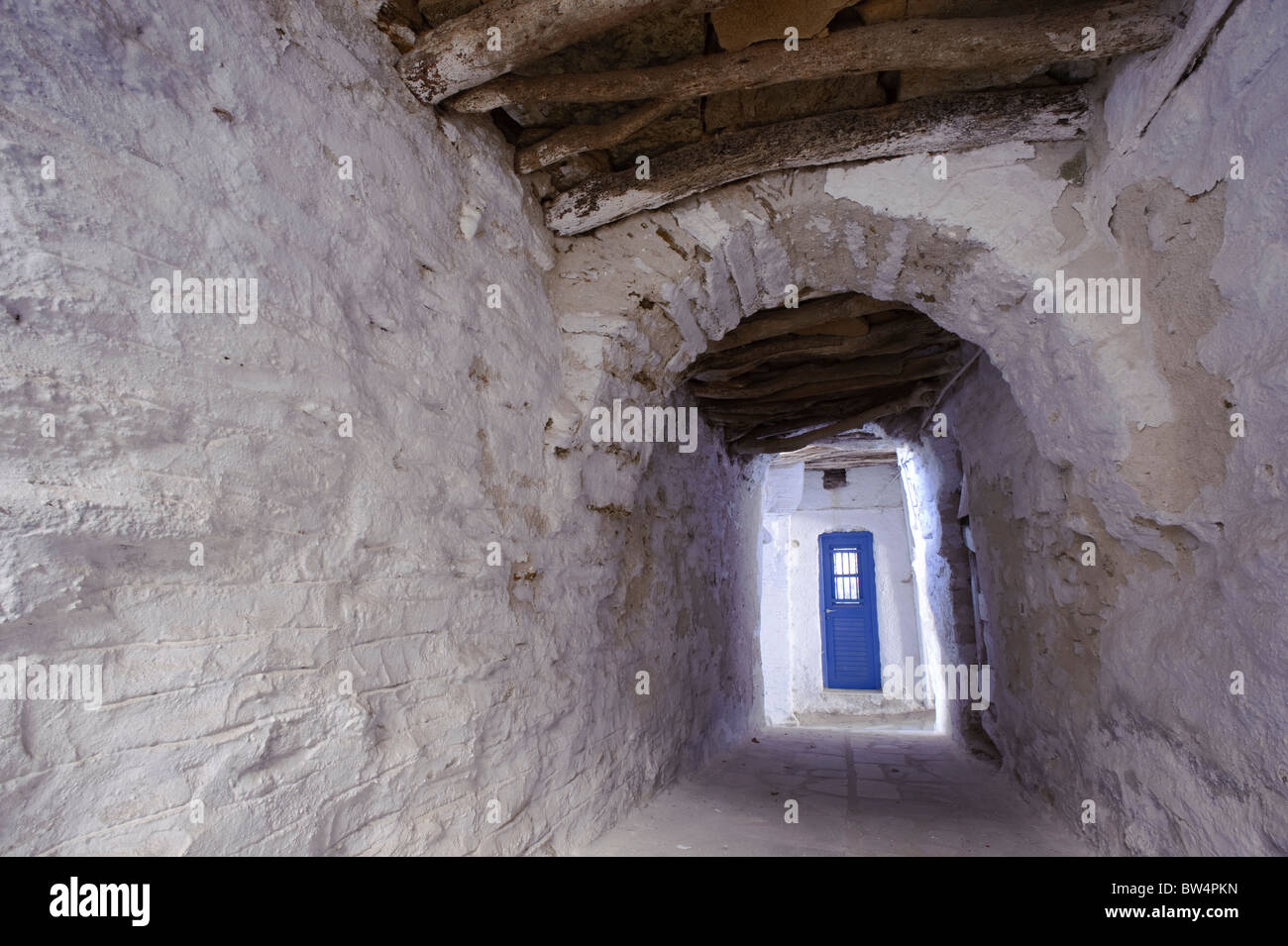 Narrow covered alleyway in Arnados, on the Greek Cyclade island of ...