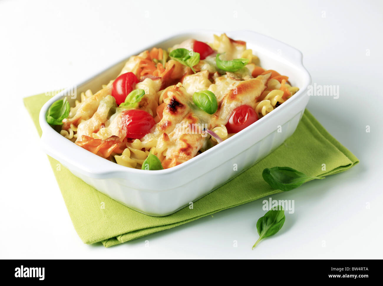 Tricolor pasta with cherry tomatoes and cheese Stock Photo - Alamy