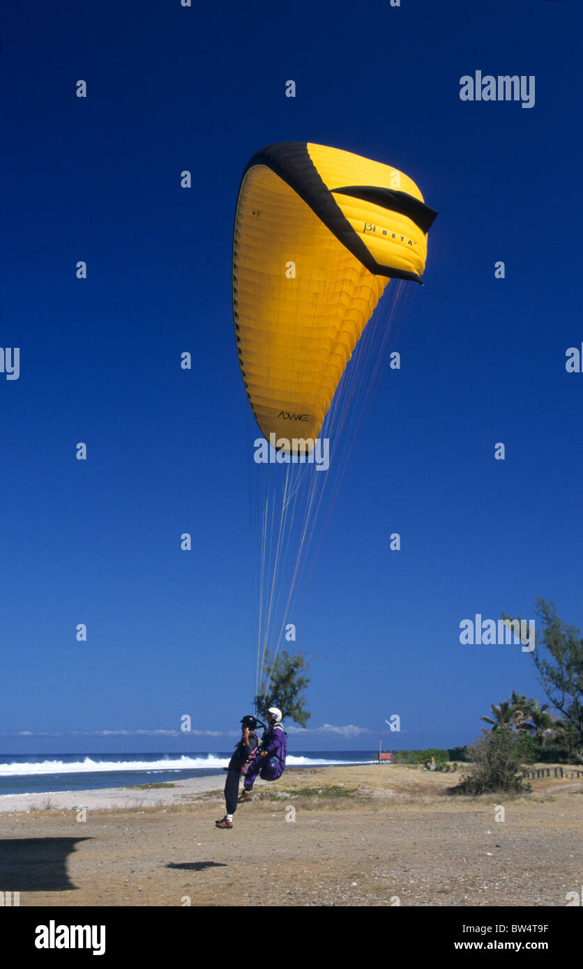 Twin seats paraglider landing on beach, Saint Leu, Reunion Island ...