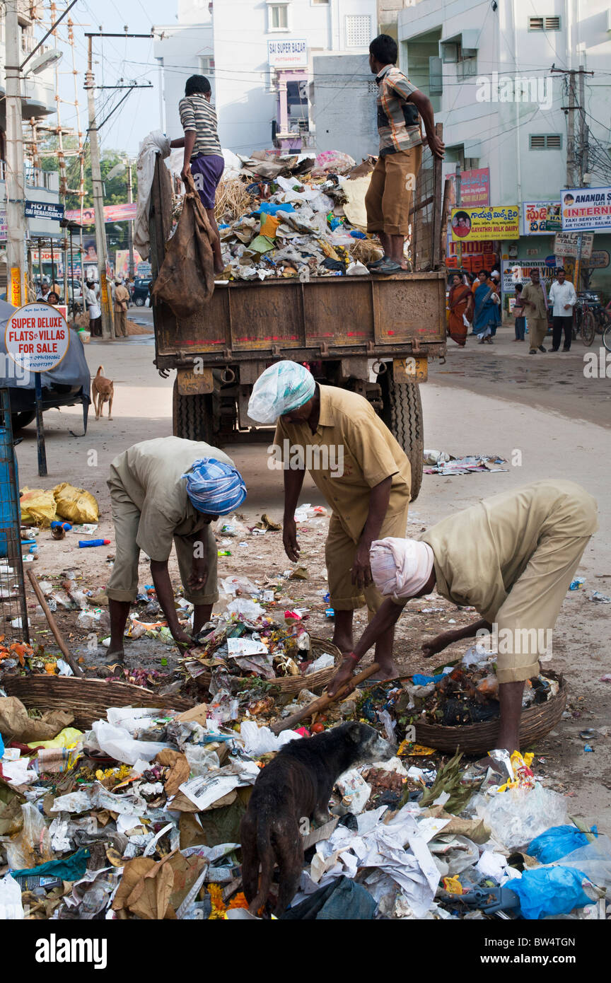 Lower Caste Indian men and boys cleaning the rubbish off the streets ...