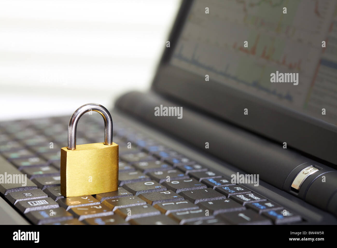 Image of open laptop keyboard with padlock on it Stock Photo - Alamy