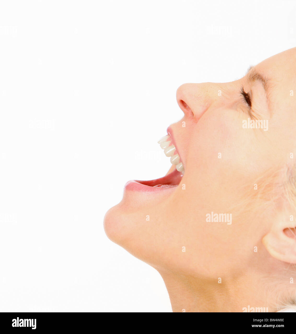 Profile of emotional female screaming in isolation Stock Photo - Alamy