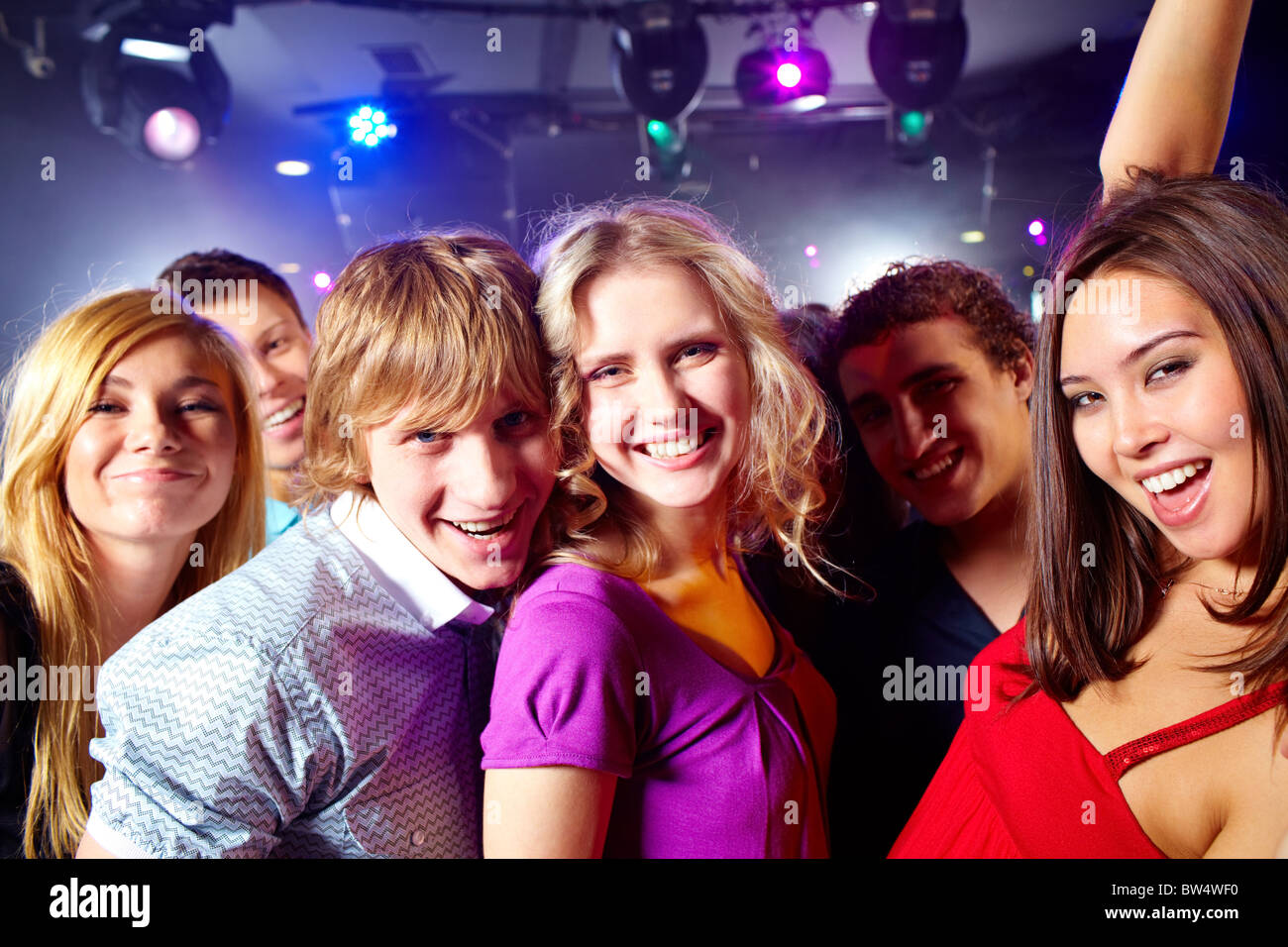 Portrait of happy glamorous friends in a night club Stock Photo - Alamy